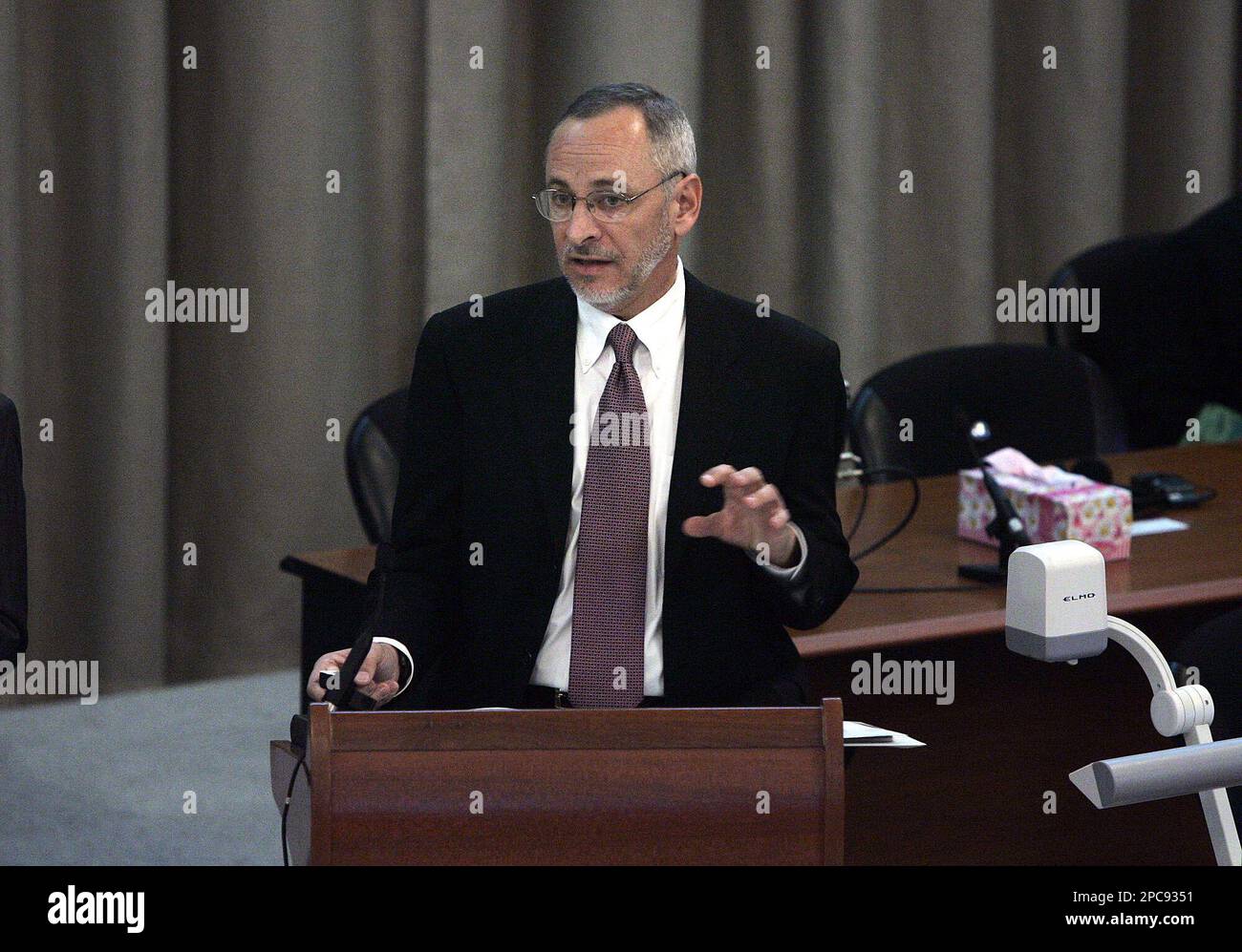 U.S. forensic archaeologist Michael "Sonny" Trimble shows slides of ...