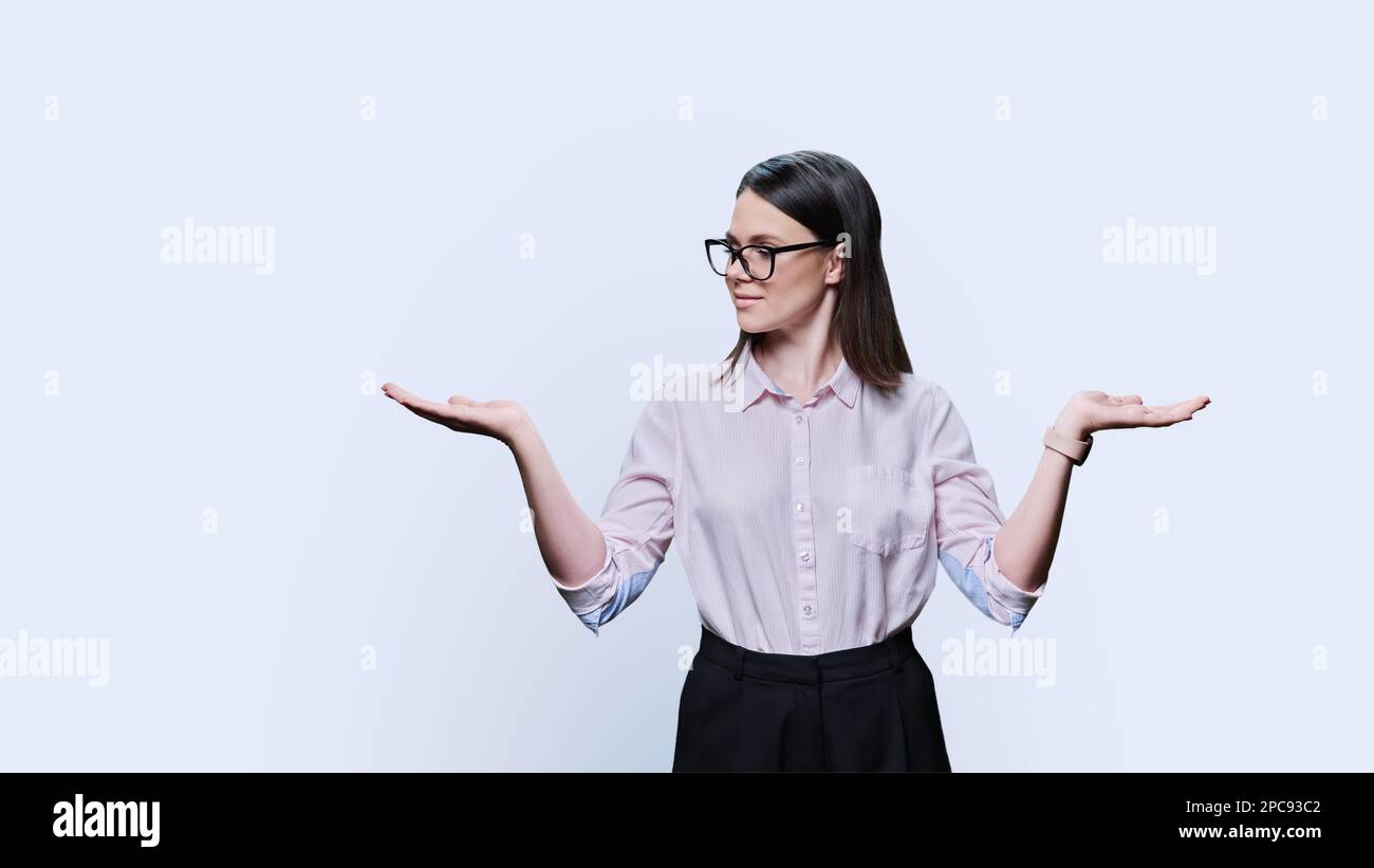 Business woman holding two hands with empty open palms on white ...