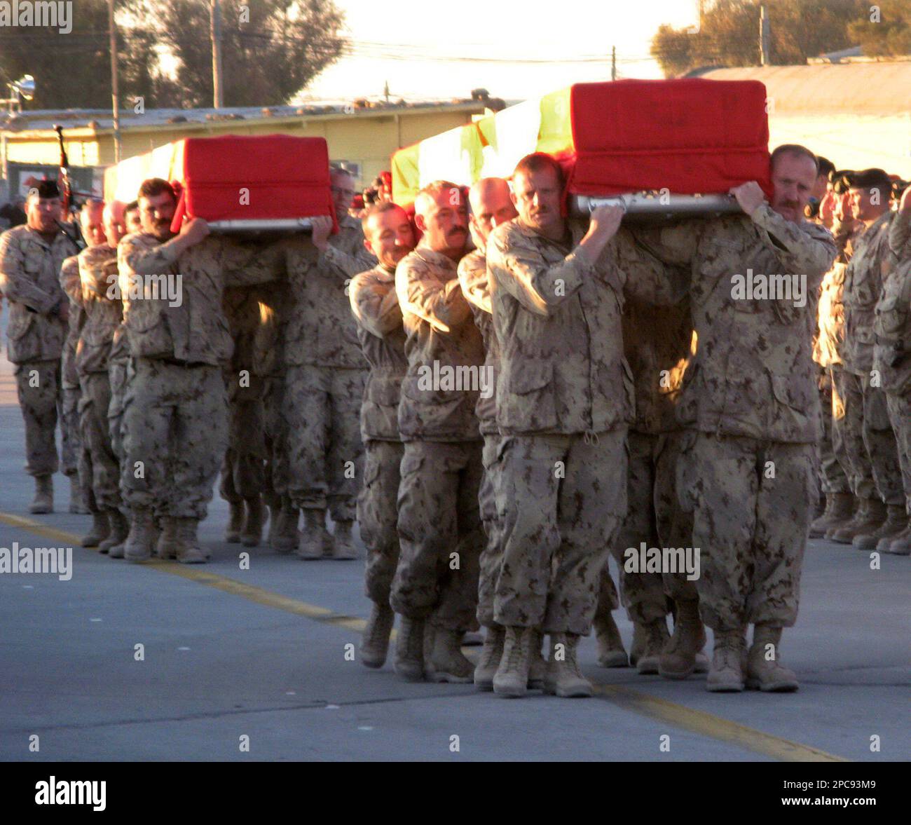 Soldiers carry a coffin of a Canadian soldier during a ceremony at ...