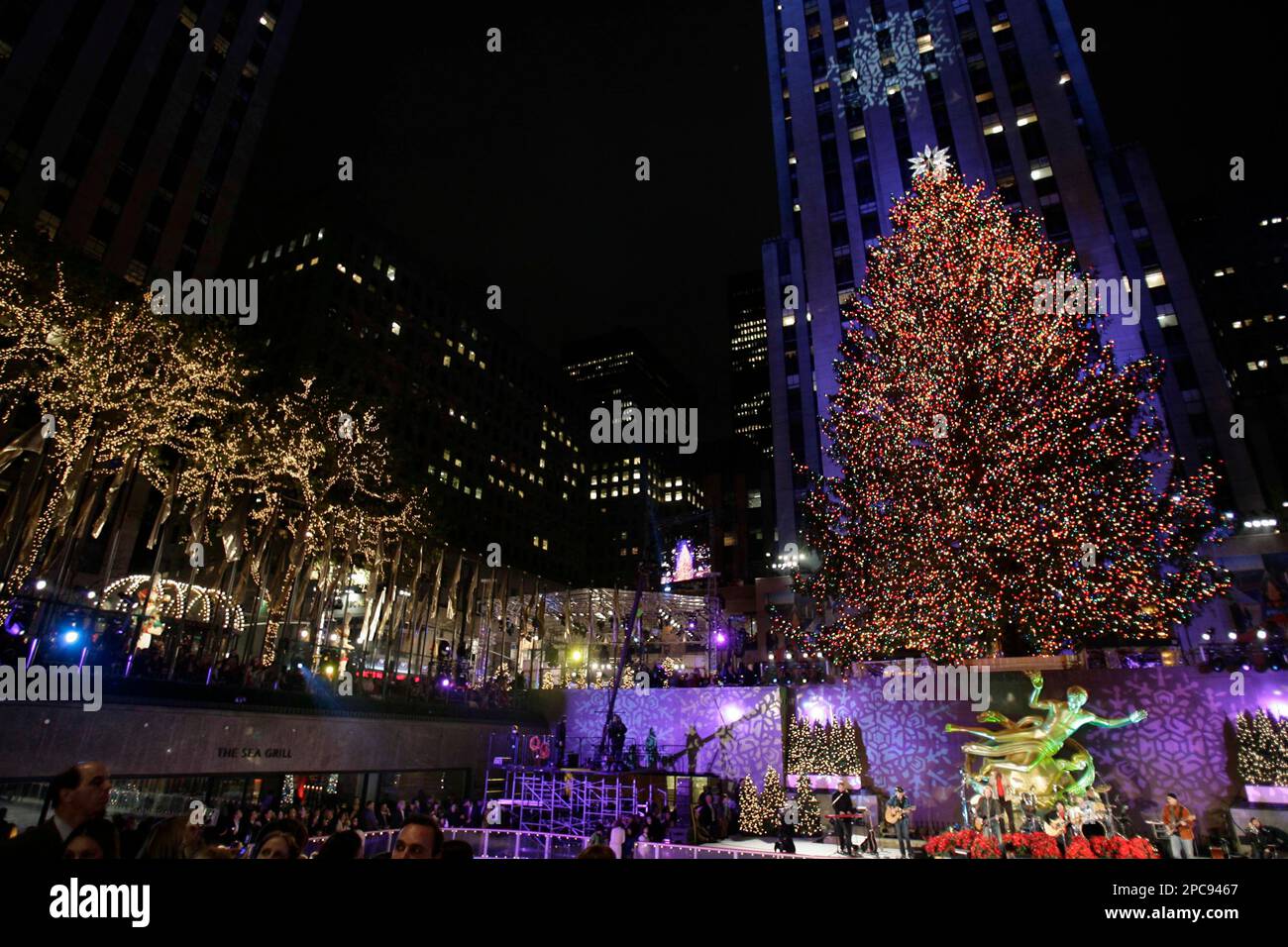 The Rockefeller Center Christmas tree is lit in New York, Wednesday ...