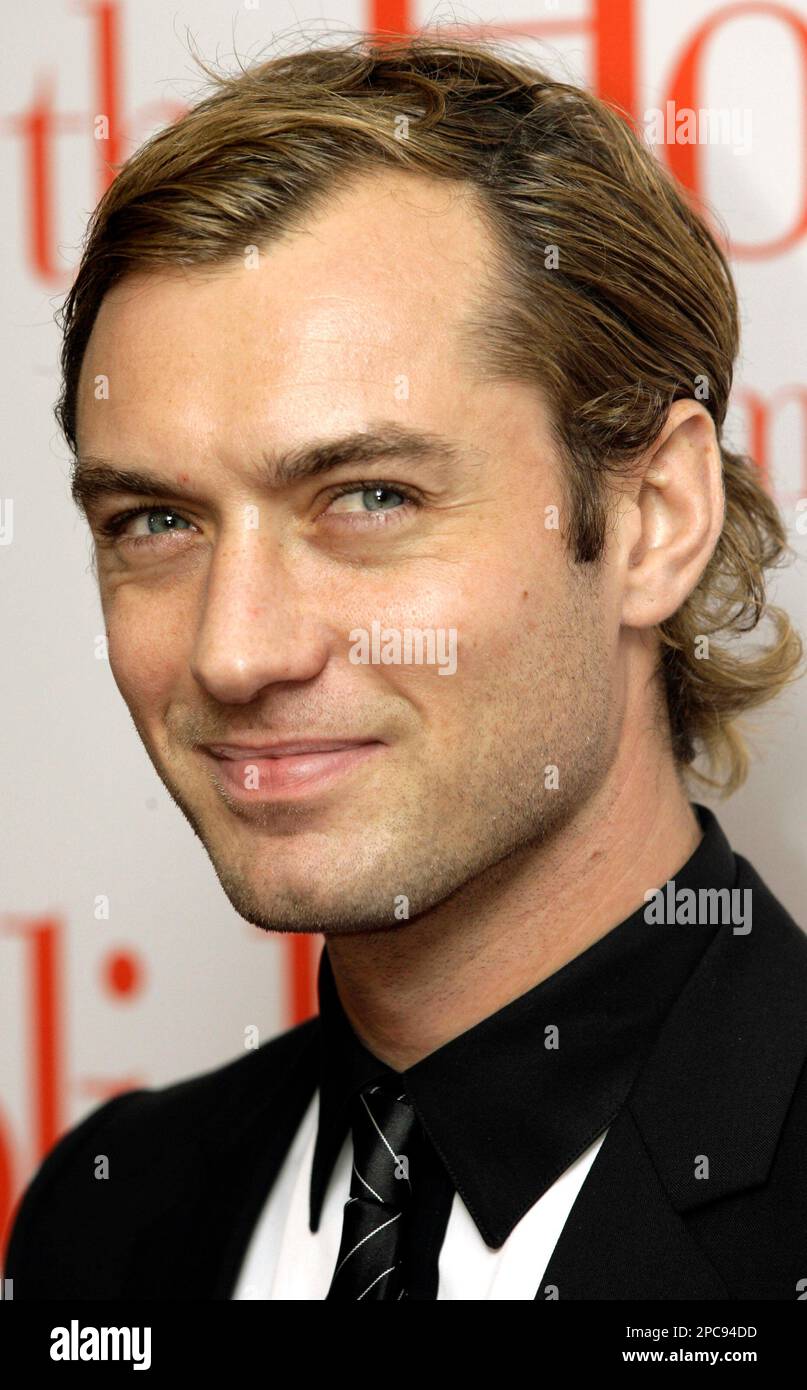 Actor Jude Law poses for photographers during red-carpet arrivals to ...
