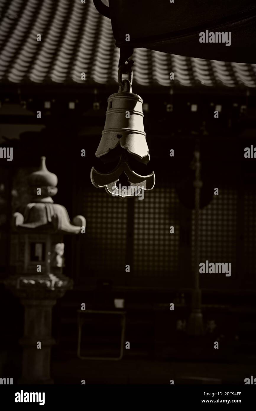 A close-up shot of a bell hanging in a temple setting Stock Photo - Alamy