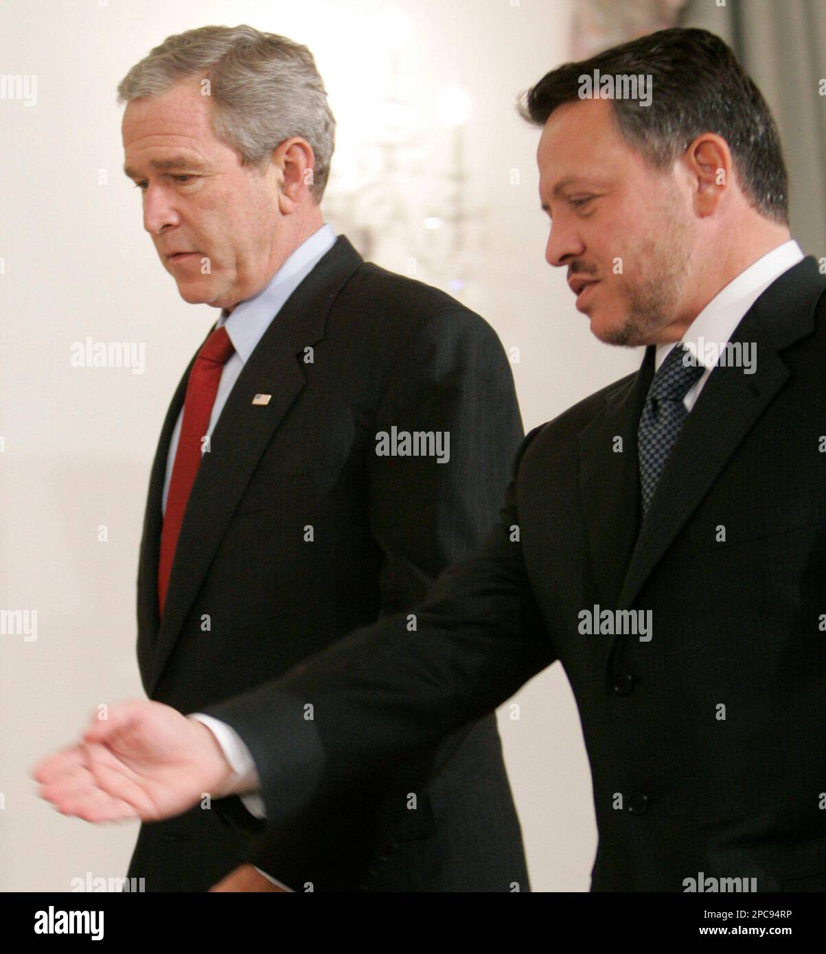 U.S. President George W. Bush, left, walks in with King Abdullah II of ...
