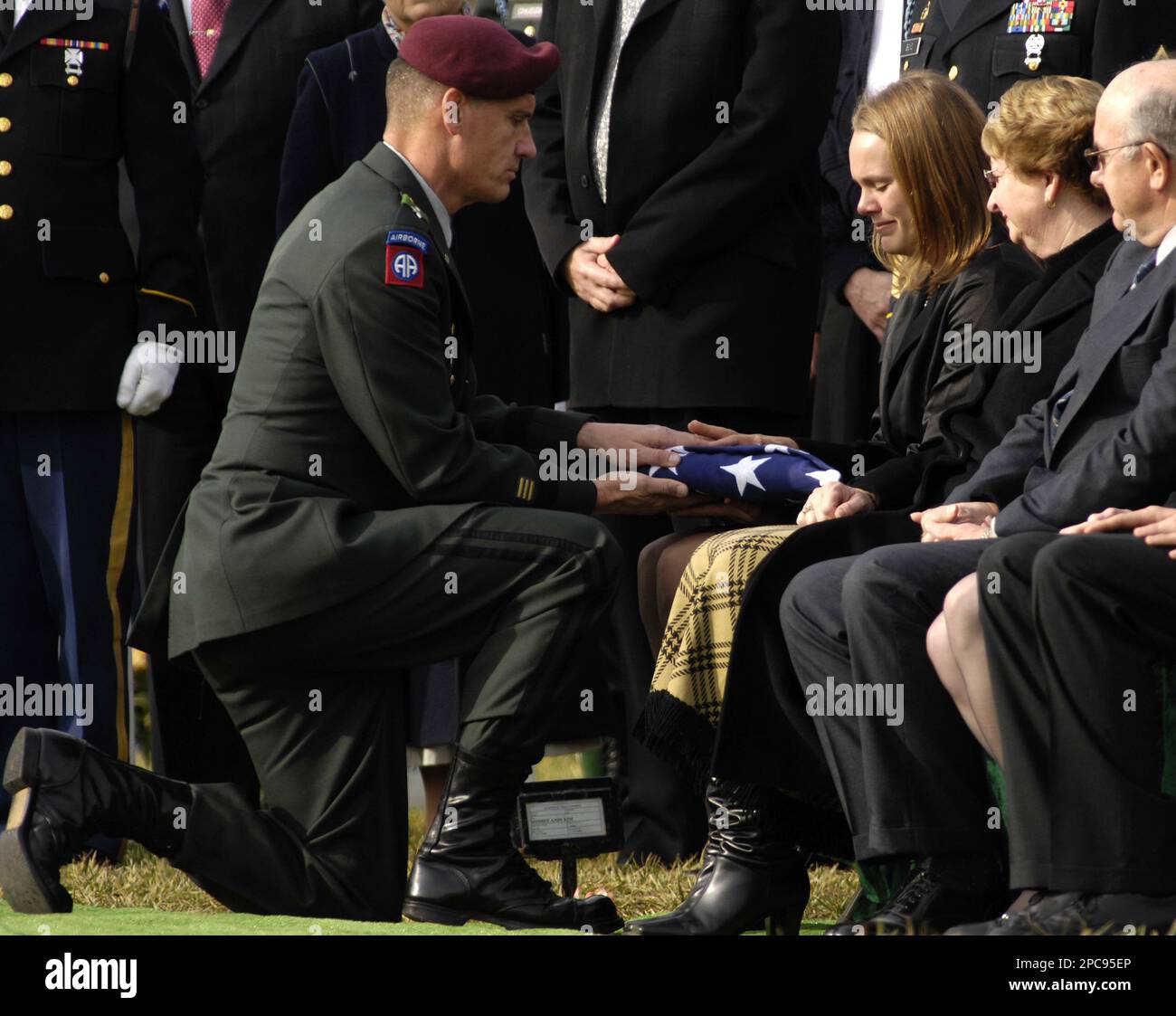 Maj. Gen. David Rodriguez, left, presents the flag from the casket of ...