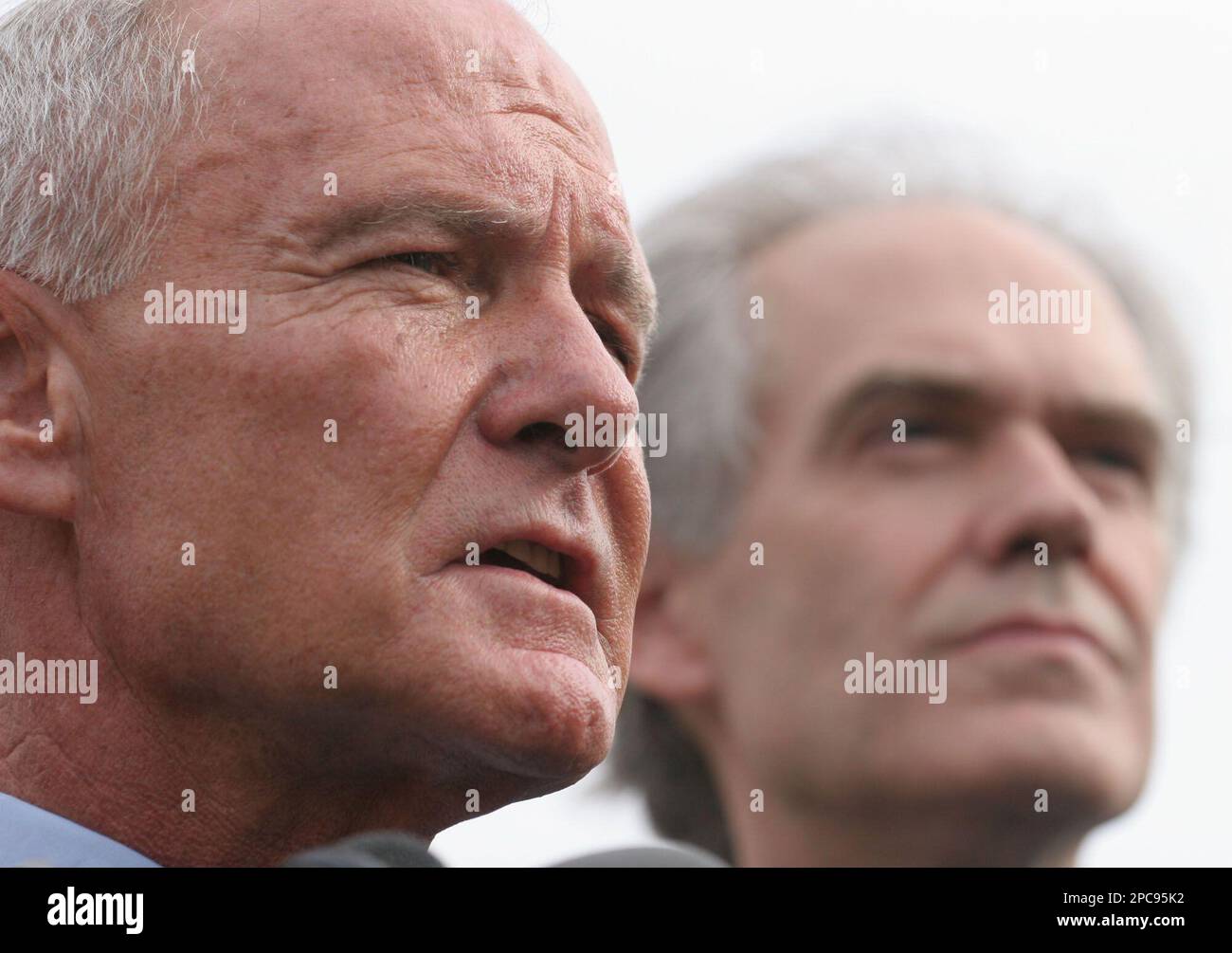 Massachusetts Attorney General Thomas Reilly, left, accompanied by ...