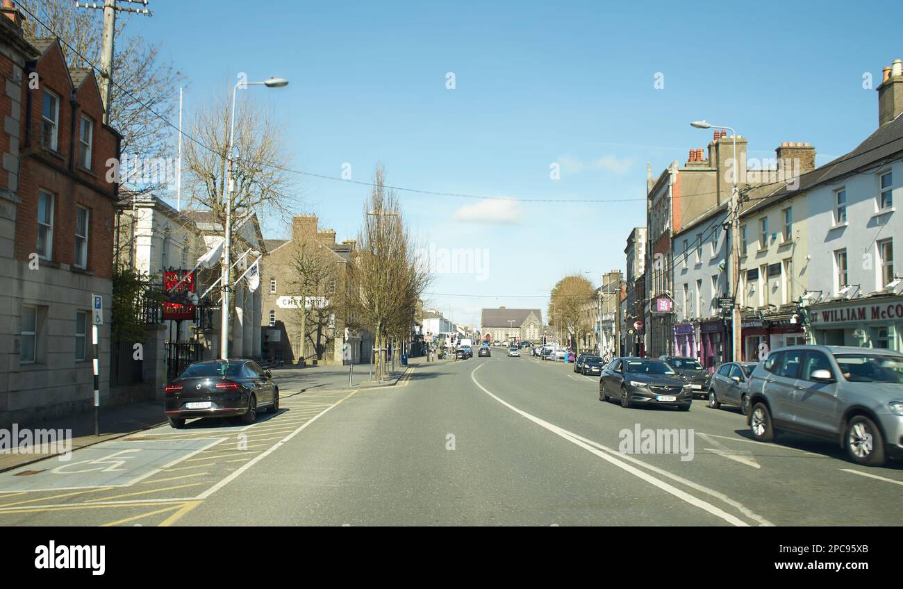 Naas, Ireland - 04.03.2022: Rear view of cars driving on street road ...