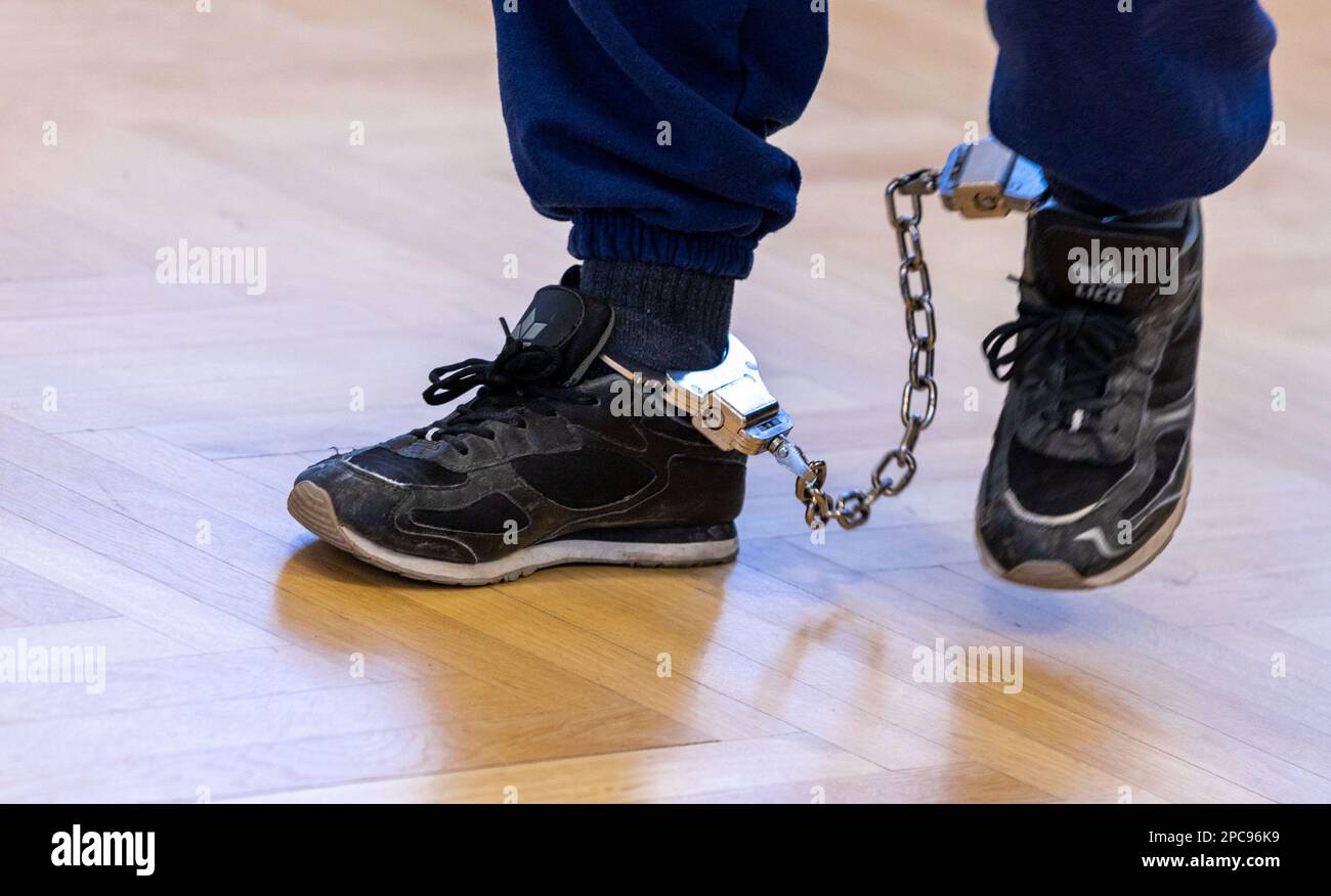 Rostock, Germany. 13th Mar, 2023. The defendant is led to the dock in ...
