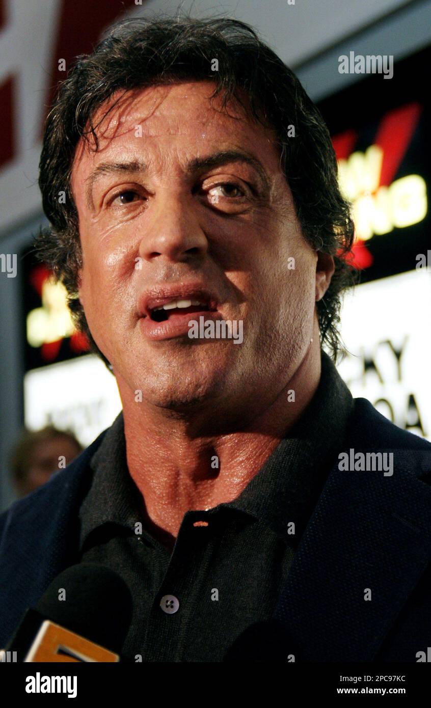 Actor Sylvester Stallone talks to media as he arrives for a special ...