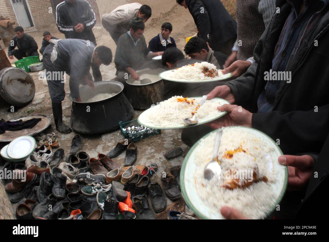 Iranian villagers prepar lunch for guests in a traditional wedding ...