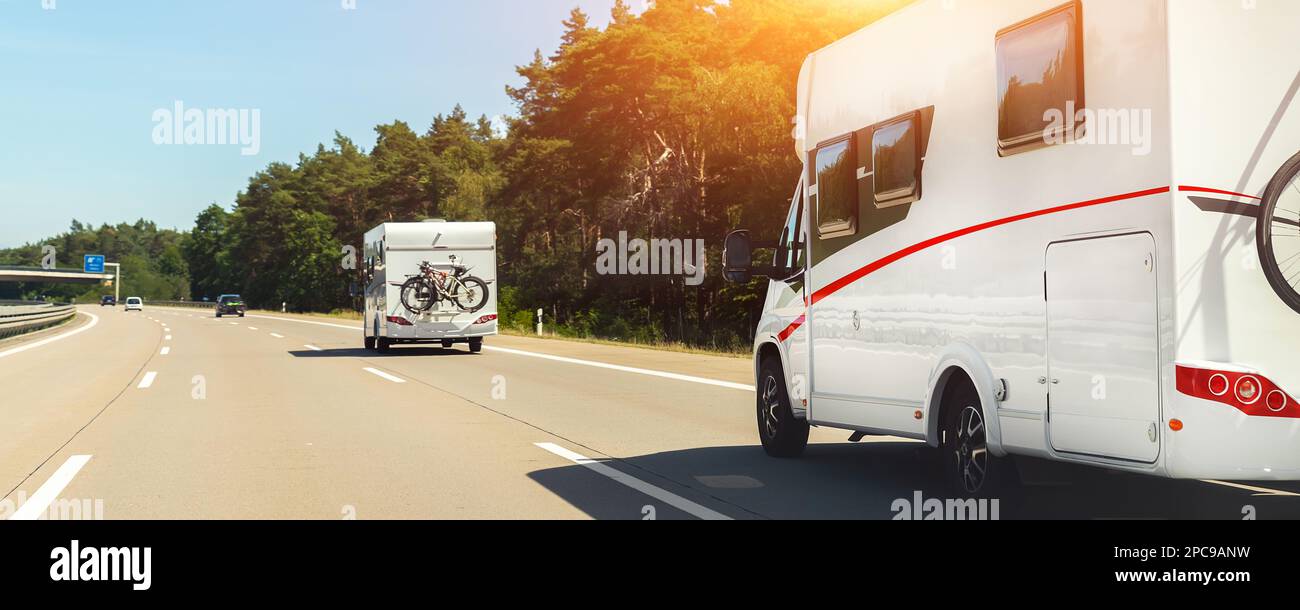 Scenic view big modern white family rv camper van vehicle driving on ...