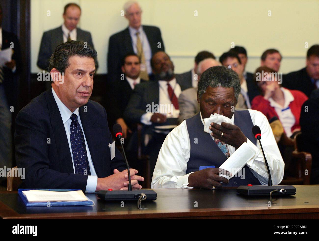 Jon Bauman, formerly "Bowzer" of Sha Na Na, listens at left, as Charlie ...