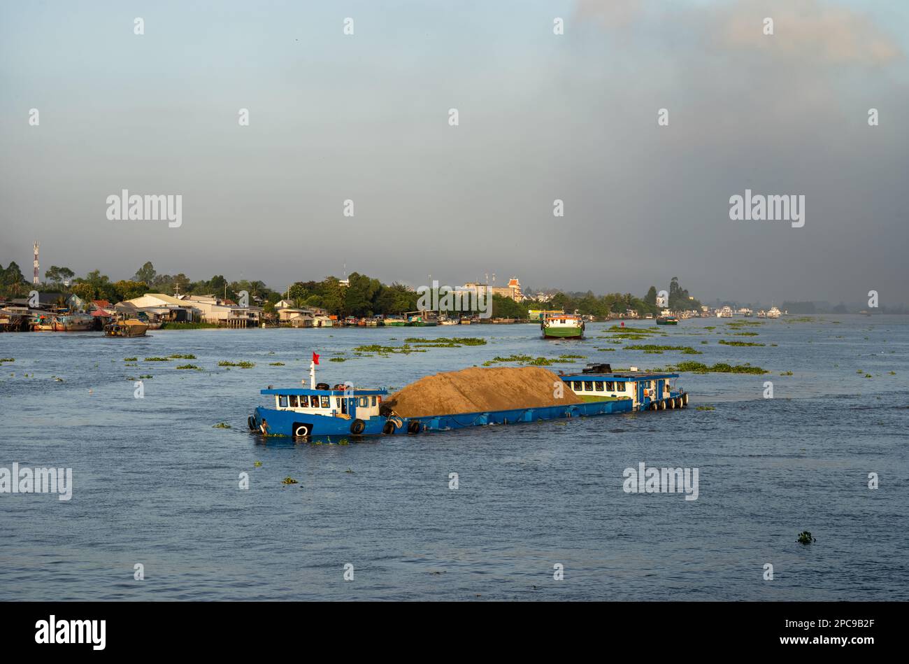 A motorised barge on the Mekong River near Long Xuyen in the Mekong ...