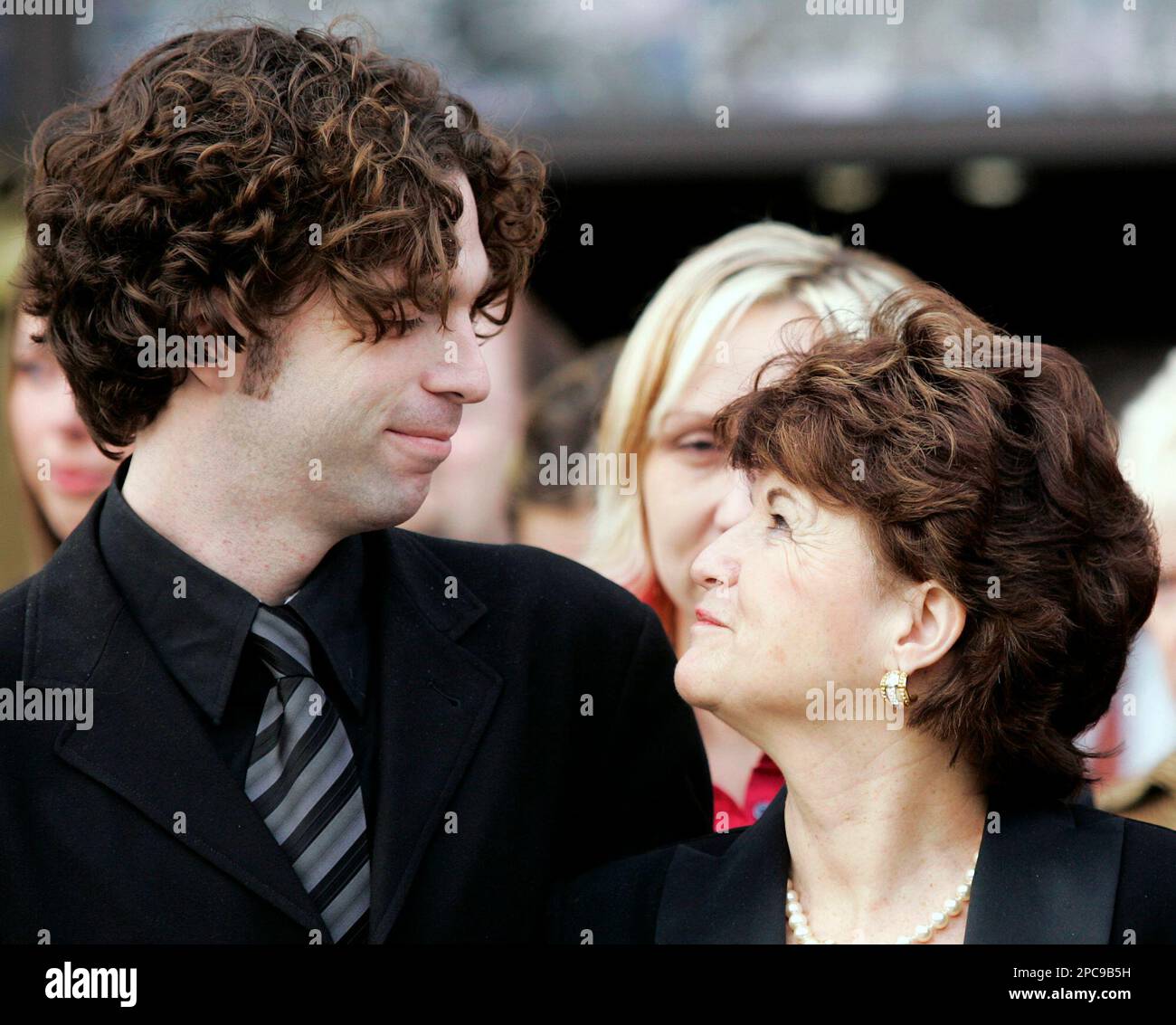 Stuart Cameron and his mother Angela share a moment during the funeral ...