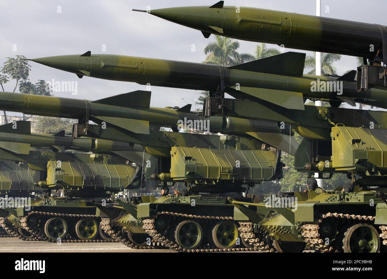 Cuban soldiers stand by missile launchers during a military rehearsal ...