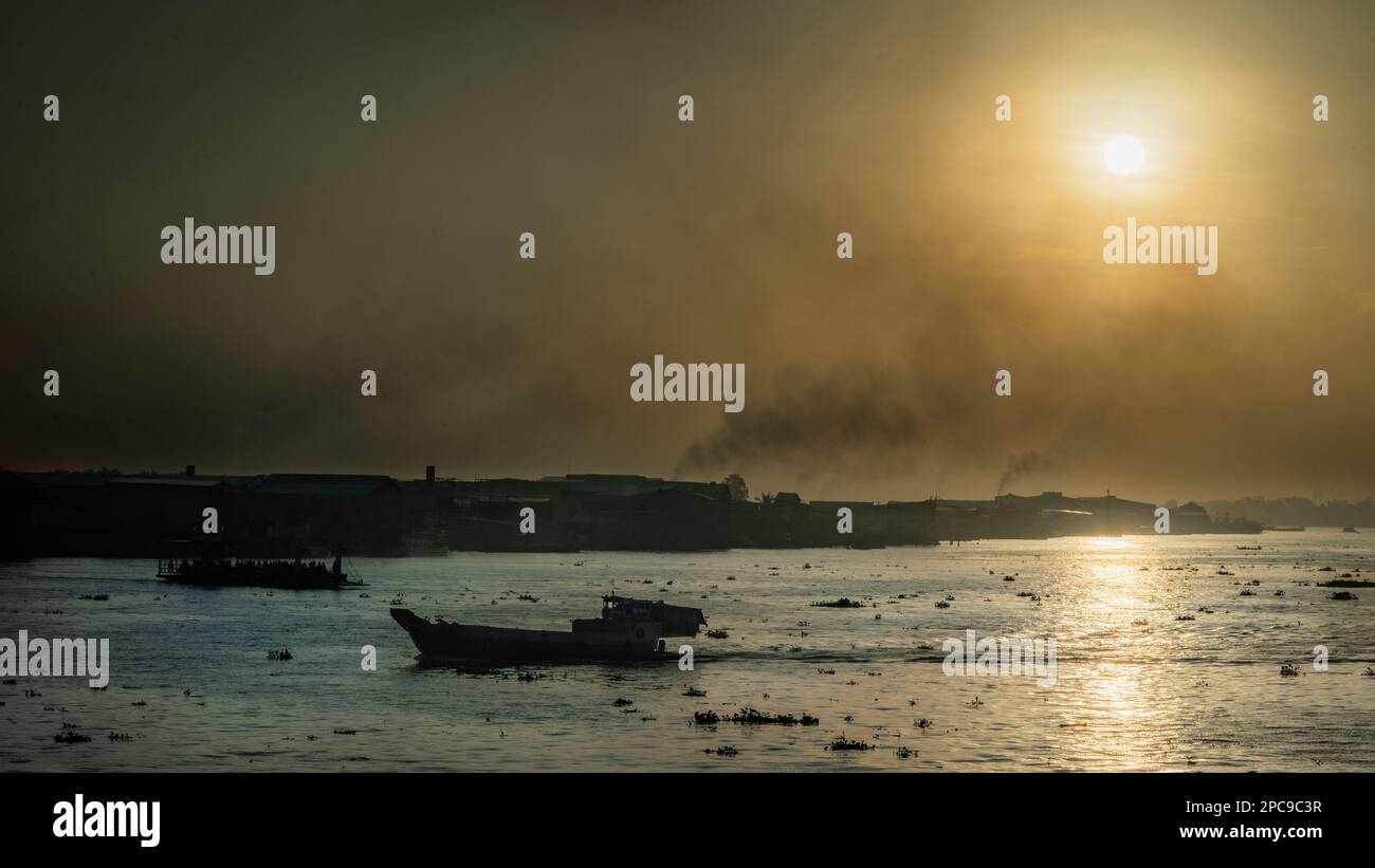 River traffic at dawn on the Mekong river at Long Xuyen in the Mekong ...