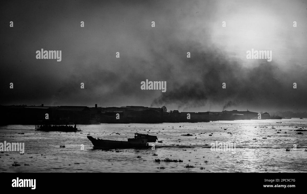 River traffic at dawn on the Mekong river at Long Xuyen in the Mekong ...