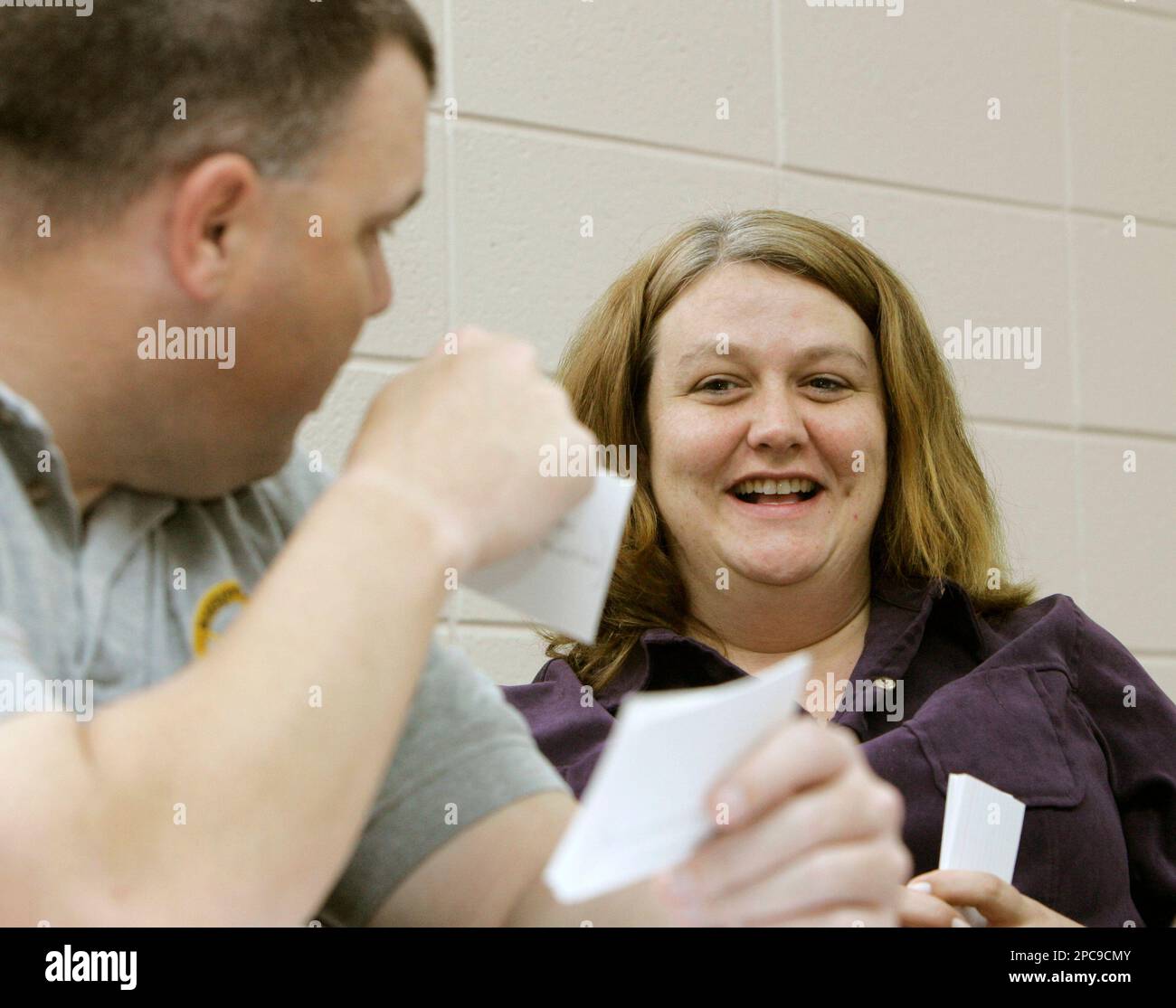 Shane Broome, left, with the Peach County Sheriff's Department, helps ...