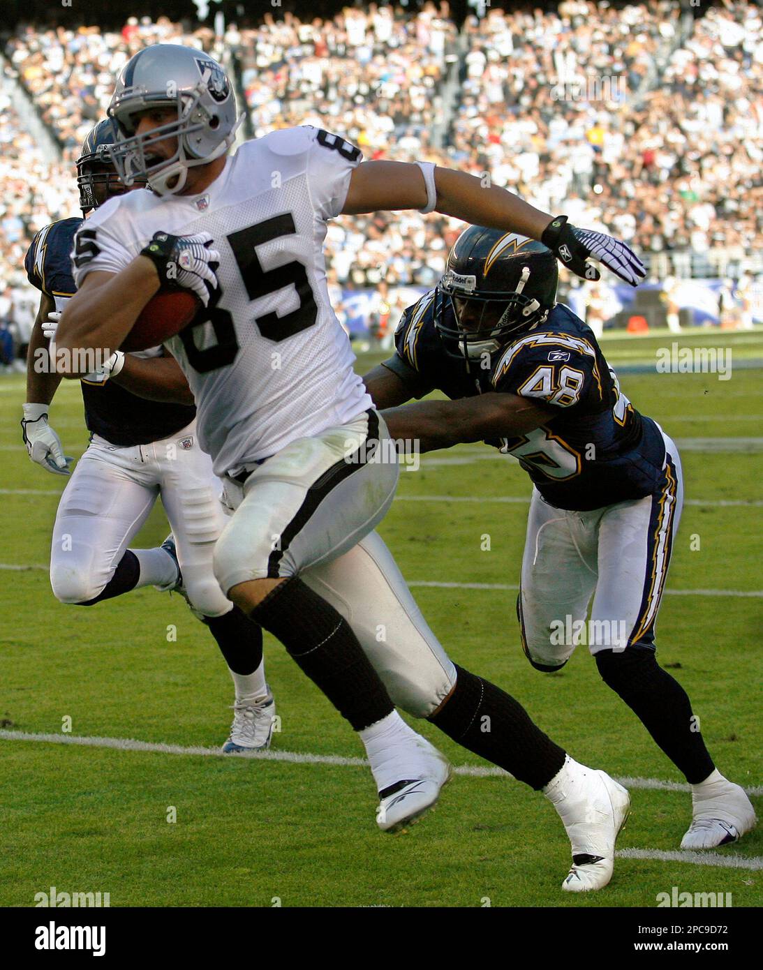 Oakland Raiders wide receiver John Madsen races the sidelines as San ...