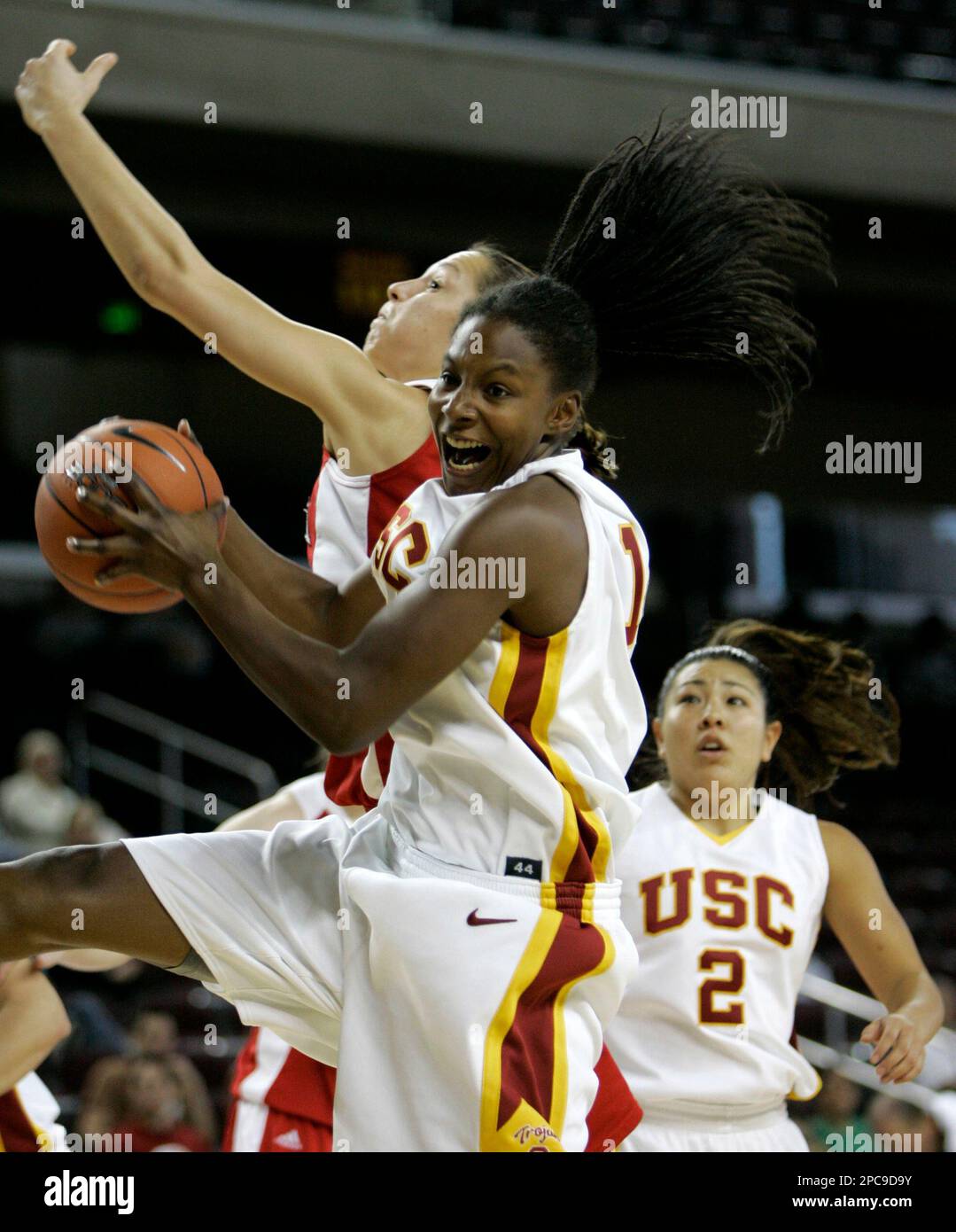 University of Southern California's Eshaya Murphy, foreground, grabs a ...