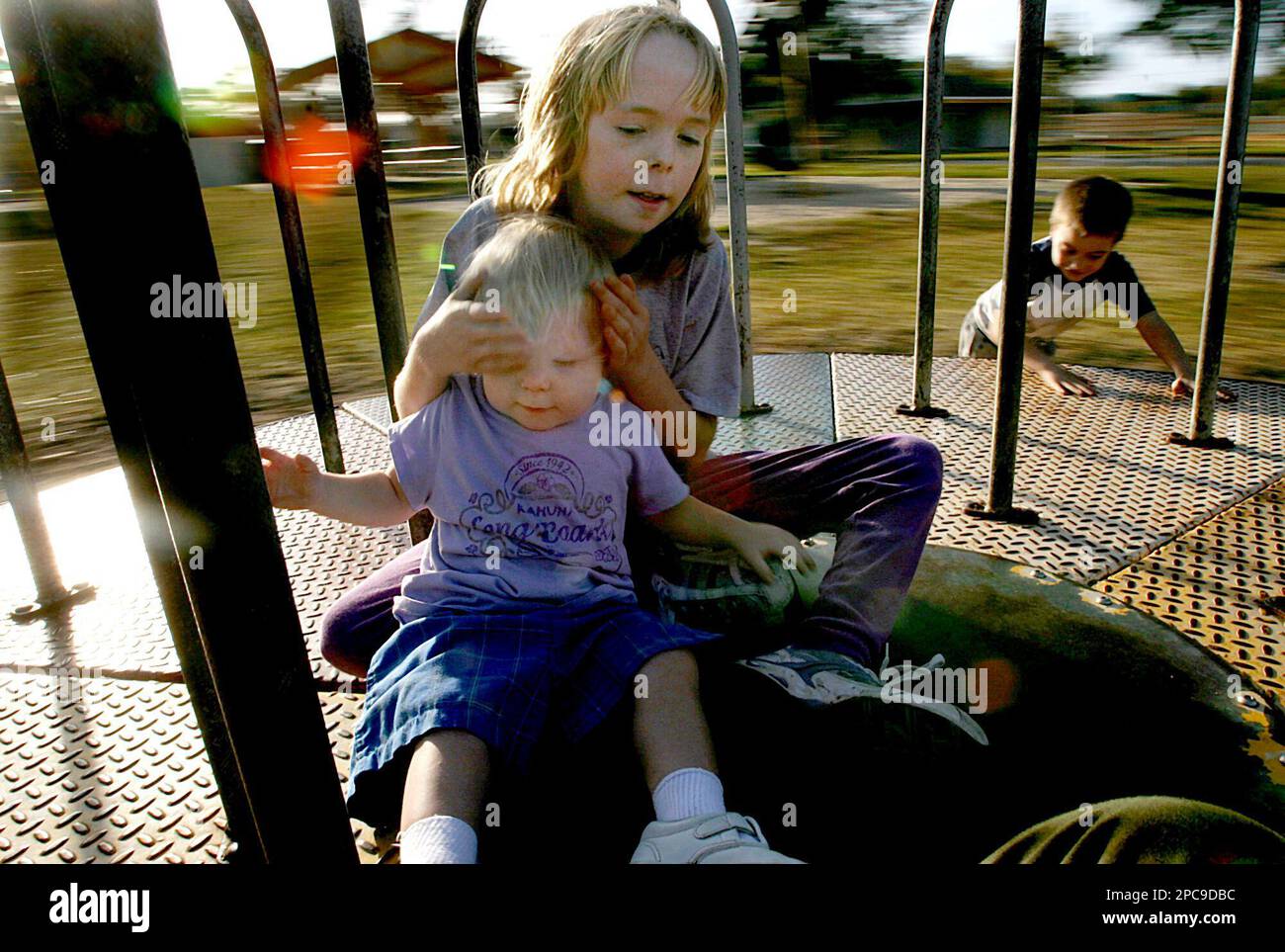 Stephanie Boebert, 9, holds her little sister, Barbara Jean, 1, while ...