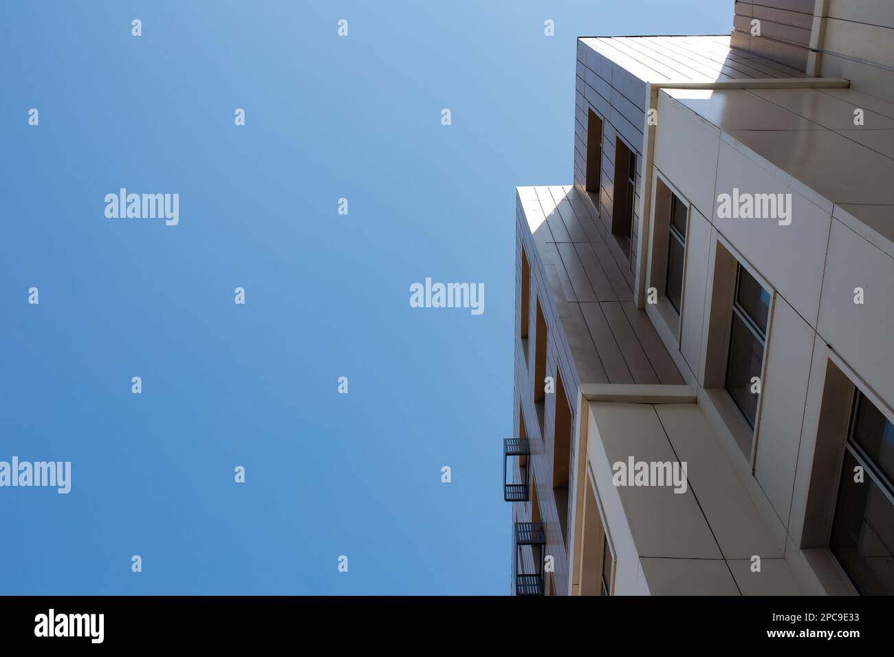 bottom view of a multi-storey building and the sky background Stock ...