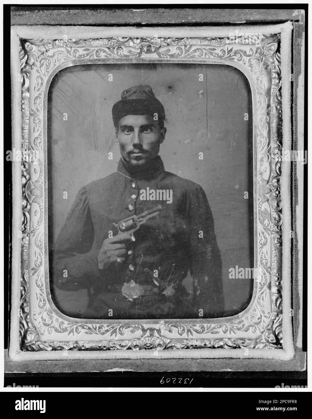 African American soldier, half-length portrait, with pistol and jacket ...