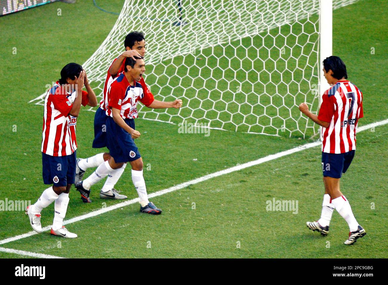Chivas' soccer player Ramon Morales, left, is congratulated by his ...