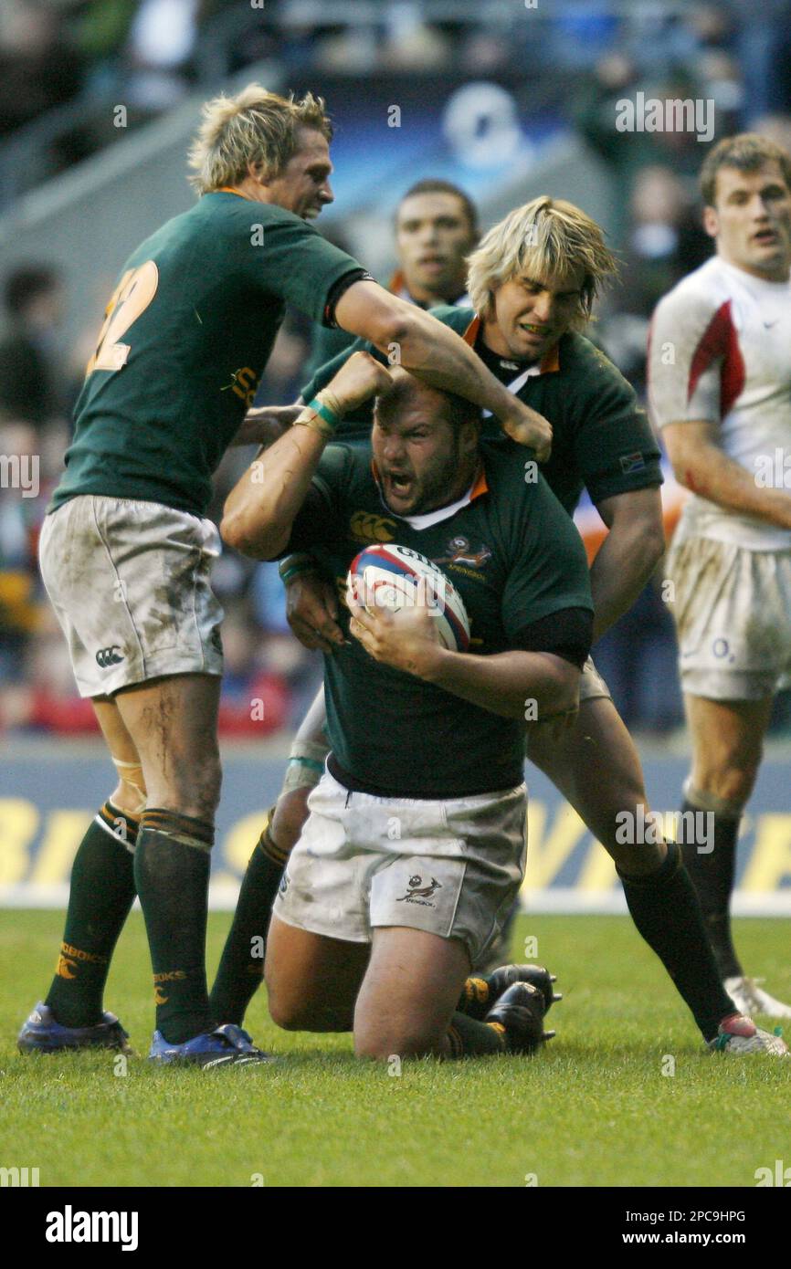 South Africa's CJ van der Linde, center with ball, celebrates his try ...