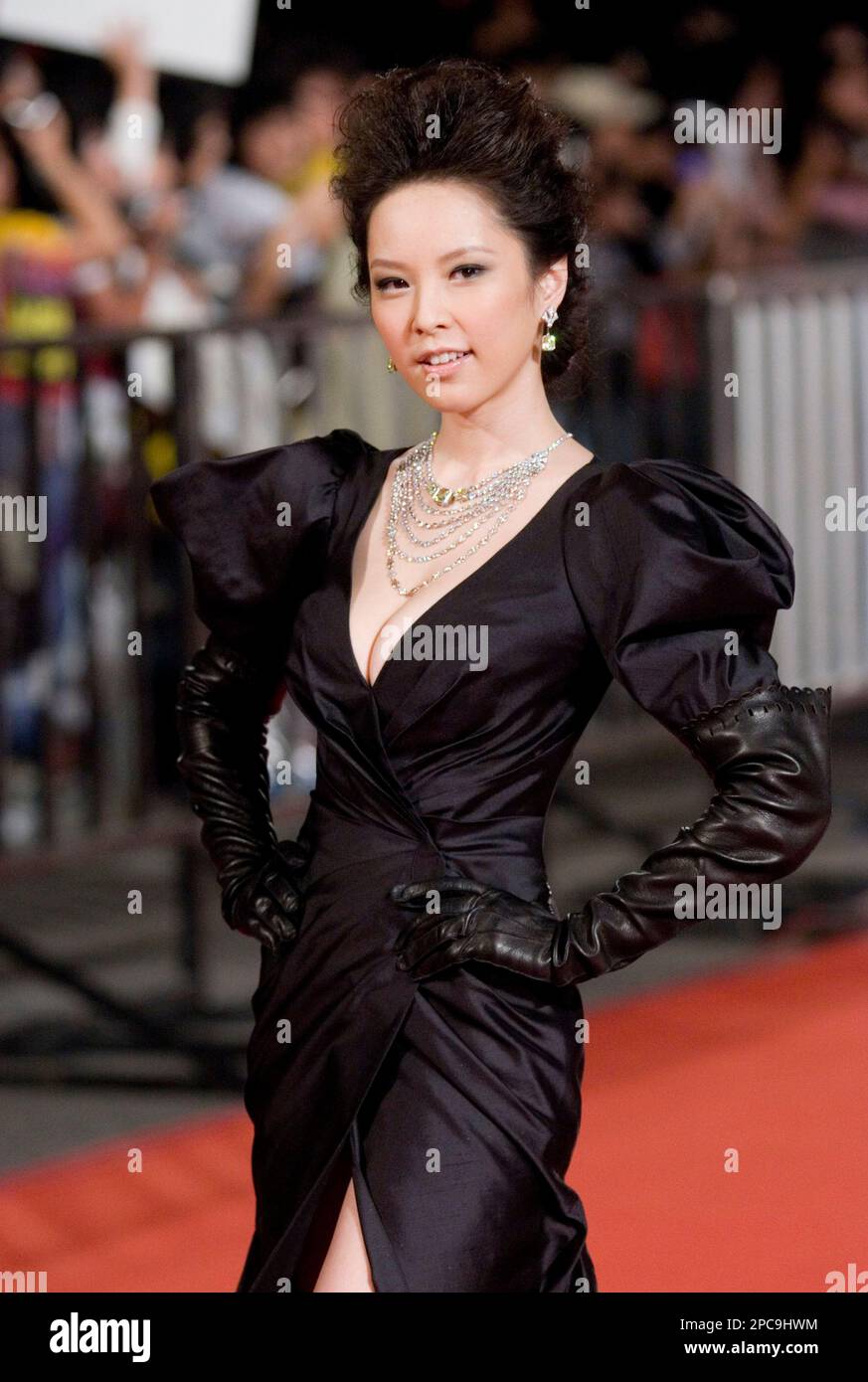 Taiwanese actress Tian Shin smiles as she arrives at the 43rd Golden ...