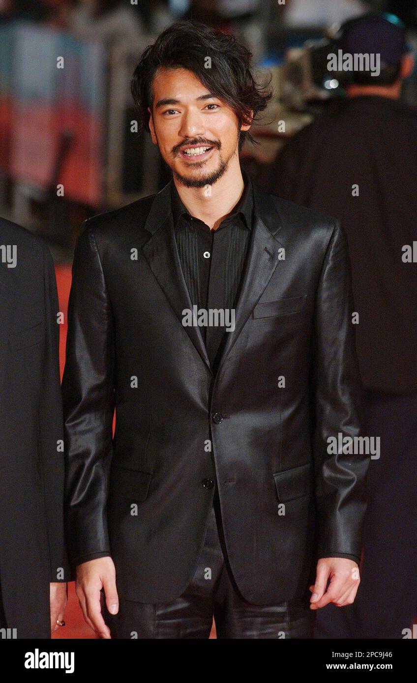 Japanese actor Kaneshiro Takeshi smiles as he arrives at the 43rd ...
