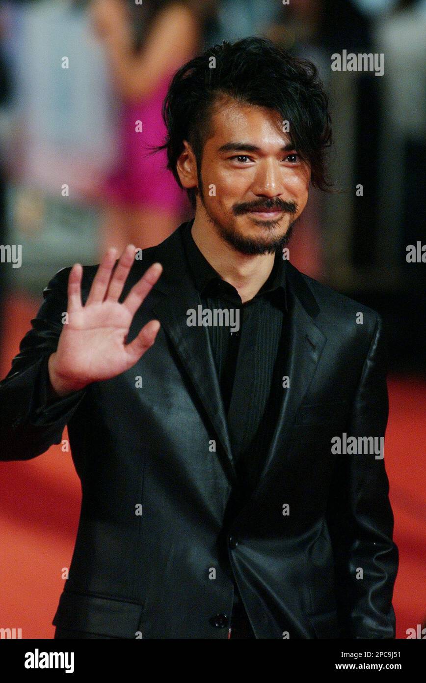 Japanese actor Kaneshiro Takeshi smiles as he arrives at the 43rd ...