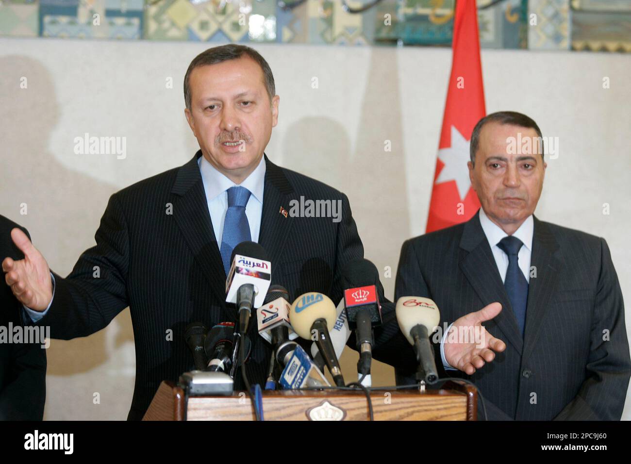 Turkish Prime Minister Recep Tayeb Erdogan, left, gestures during a ...