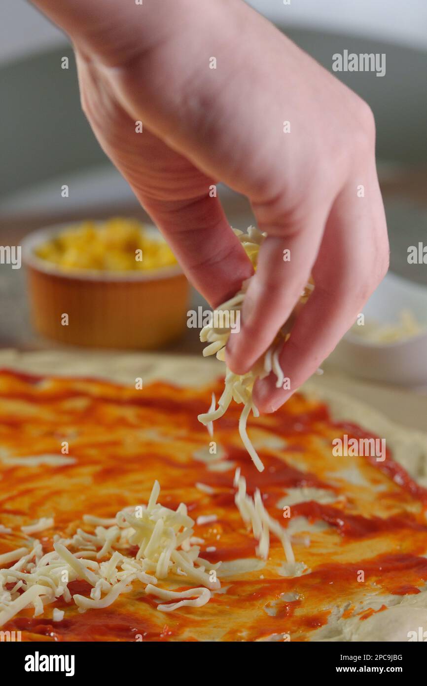 Grating cheese pizza hi-res stock photography and images - Alamy
