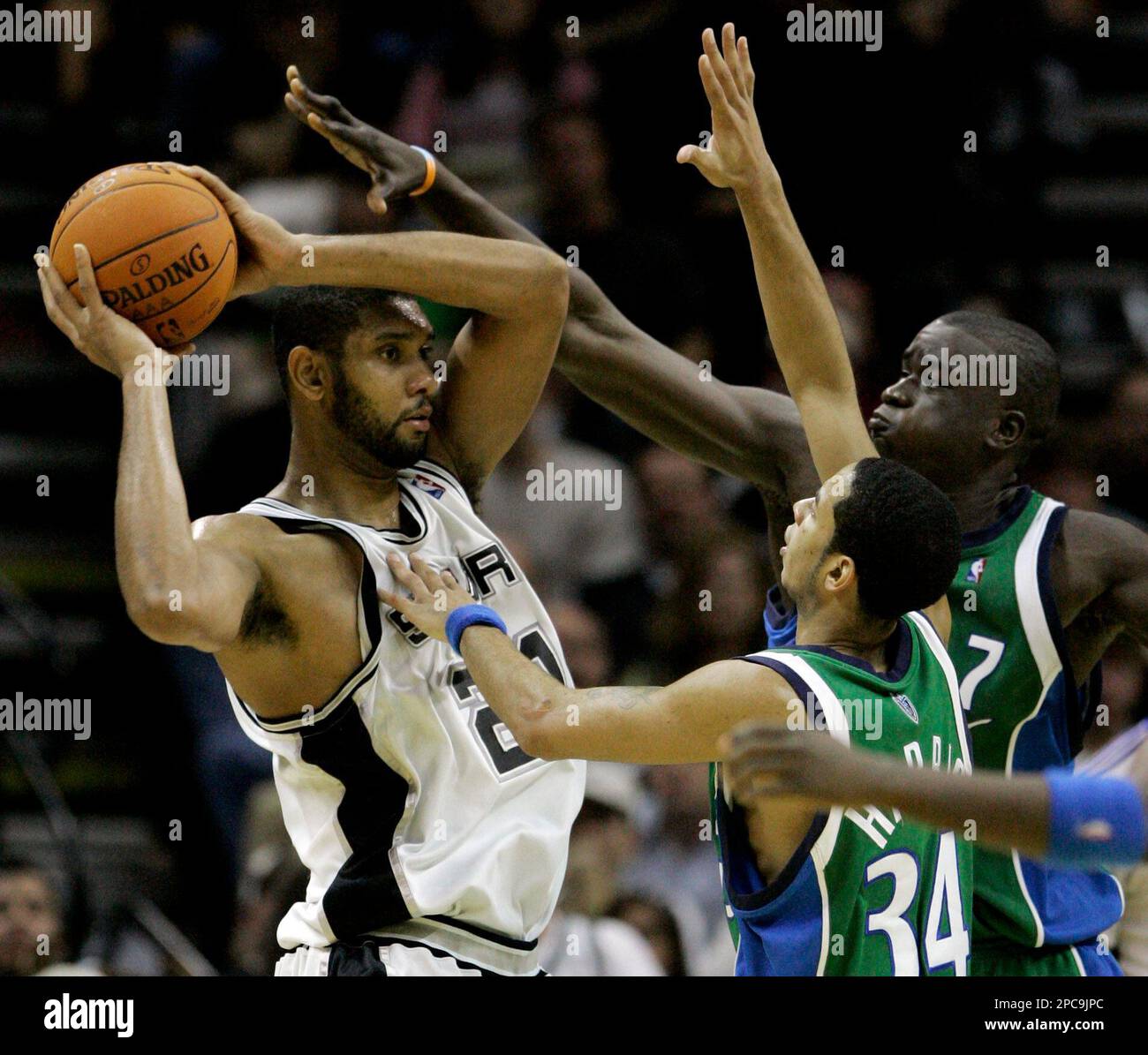San Antonio Spurs forward Tim Duncan (21) is pressured by Dallas ...