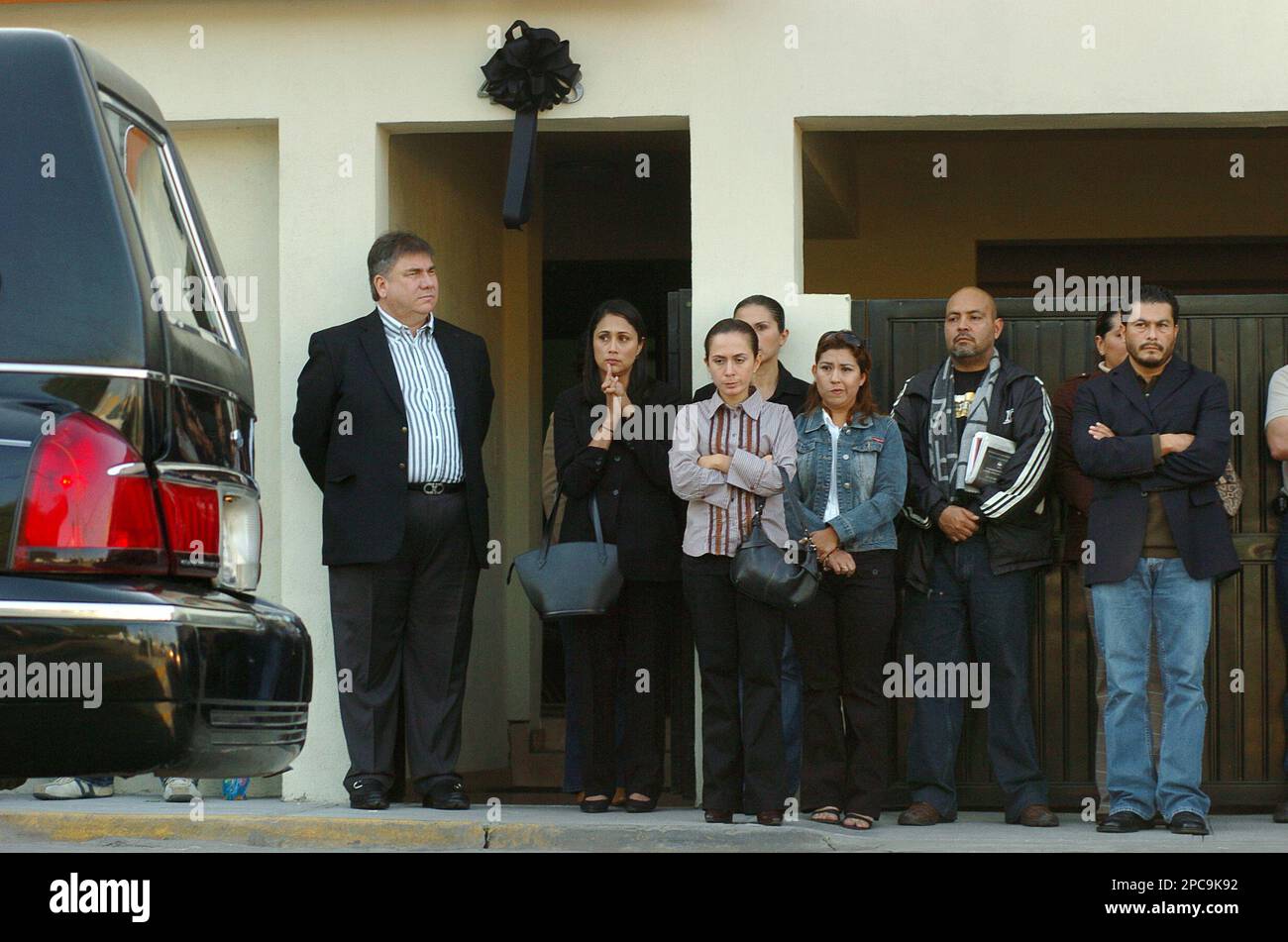 Employees at the Tijuana newspaper Zeta pay their respects as a hearse ...