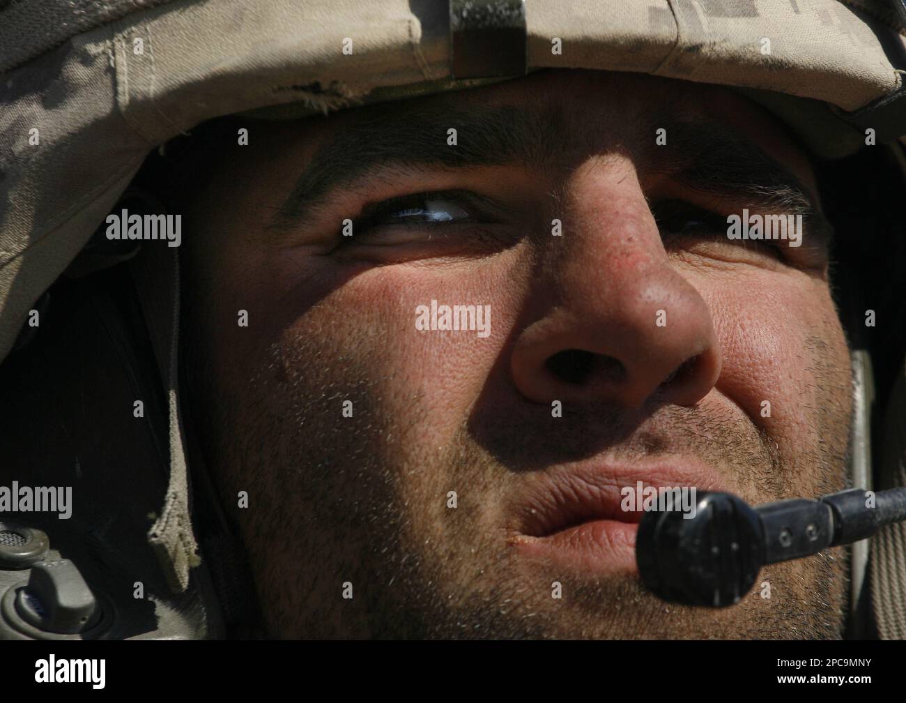 A Canadian gunner looks out from the top of his armored vehicle during ...