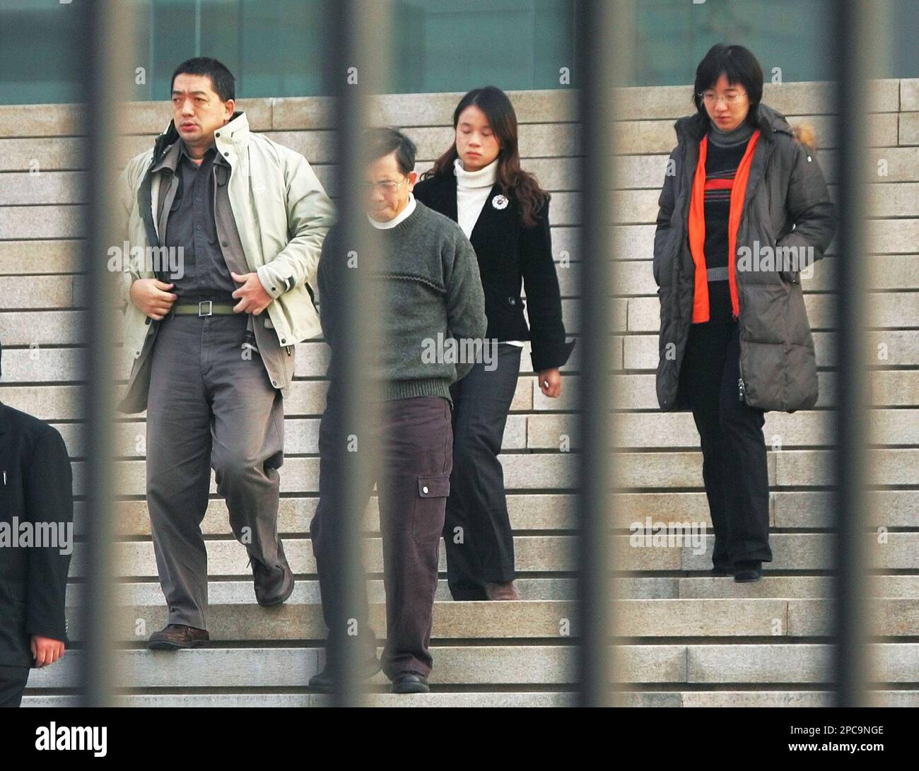 The family of jailed Hong Kong reporter Ching Cheong walk down the ...