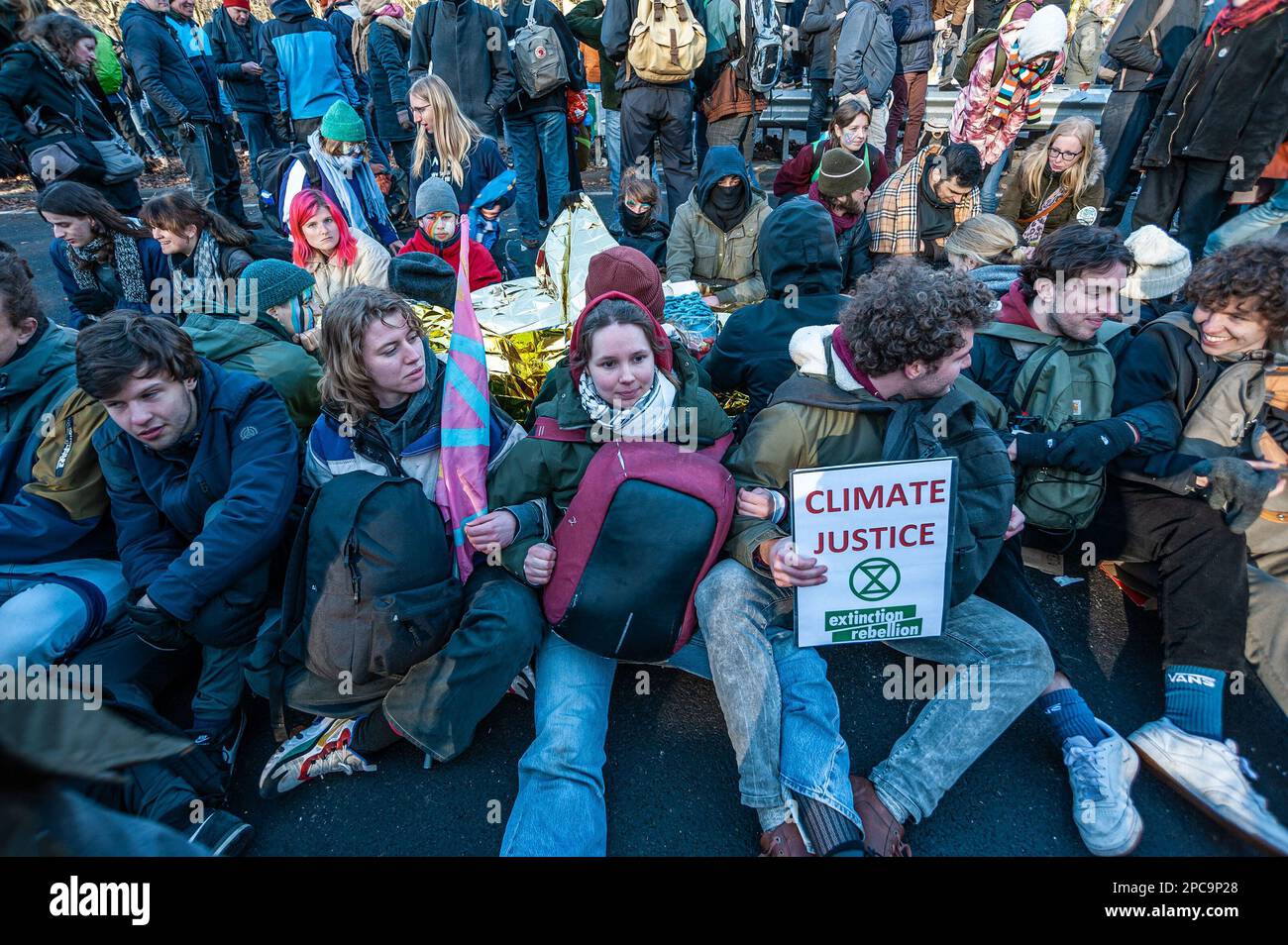 Activists from Extinction Rebellion sit-down during the demonstration ...