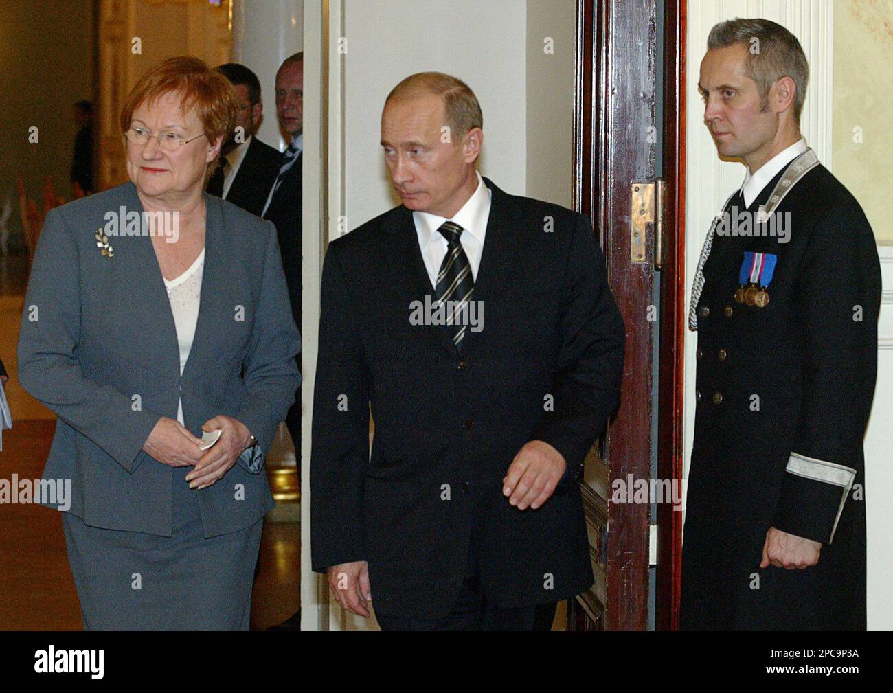 Russian President Vladimir Putin, center, and Finnish President Tarja ...