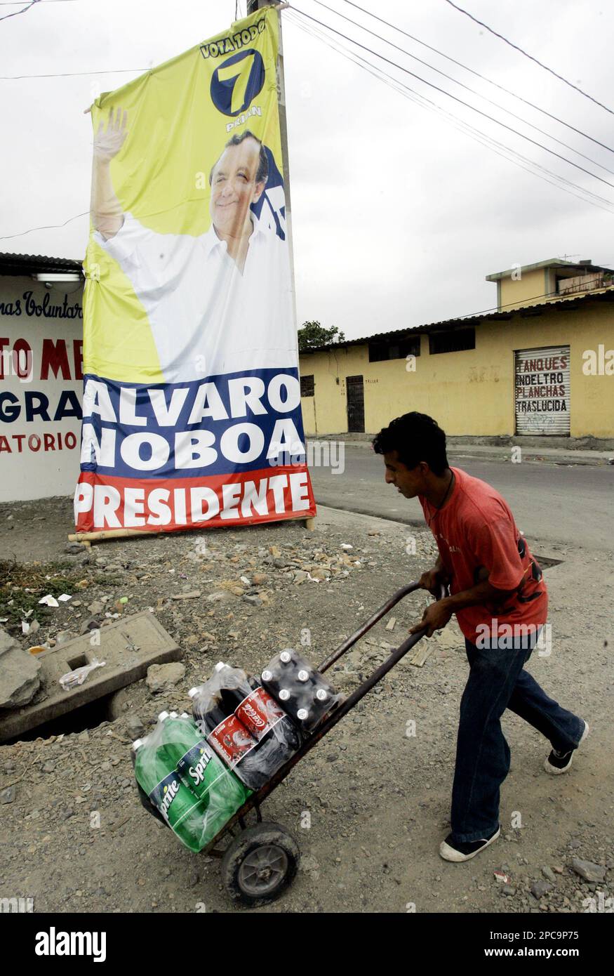 A man walks by an election banner of Ecuador's presidential candidate ...