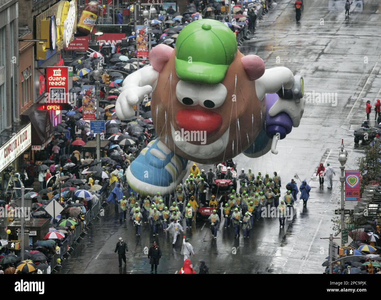 The Mr. Potato Head balloon floats down Broadway in the rain during the ...