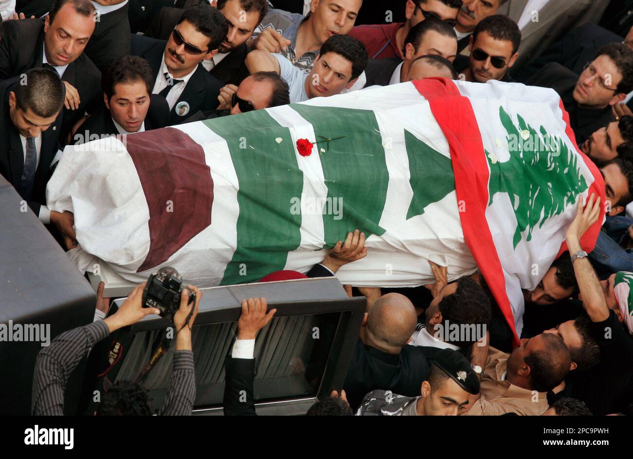 The coffin of assassinated Christian politician Pierre Gemayel, wrapped ...