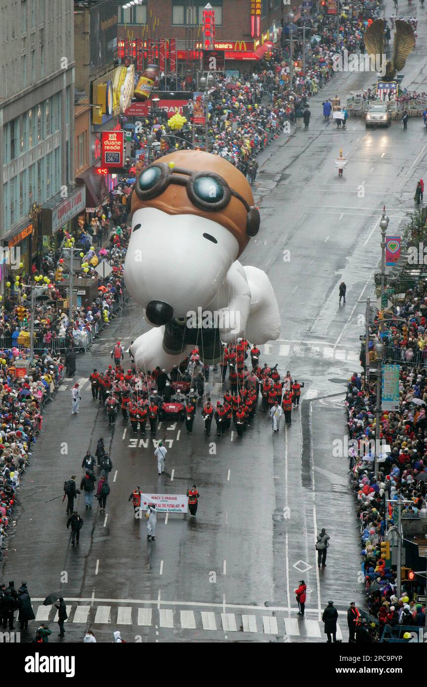 The Snoopy balloon floats down Broadway during the Macy's Thanksgiving ...