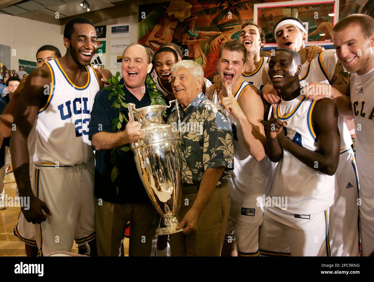 UCLA coach Ben Howland,second from left, and his team are presented ...