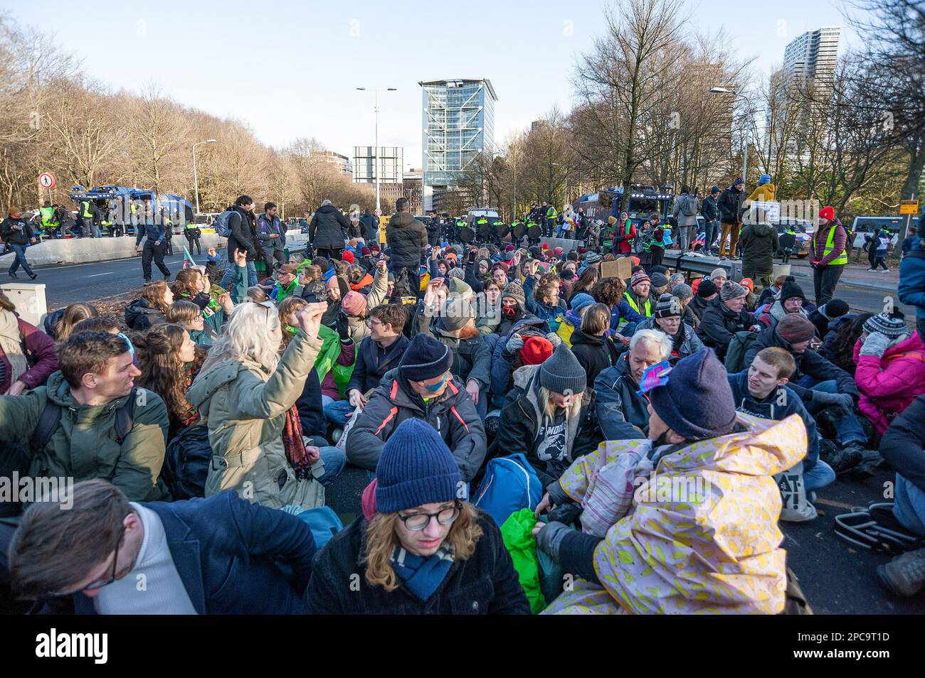 Activists from Extinction Rebellion sit-down during the demonstration ...