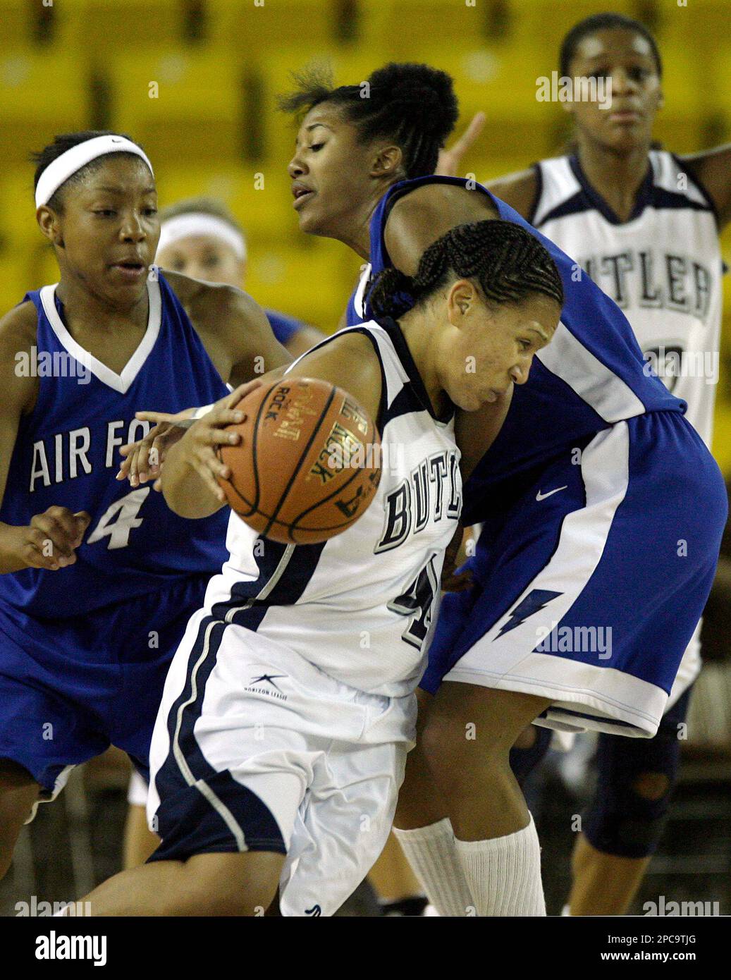 Butler's Candace Jones, center, drives through Air Force's Alecia ...