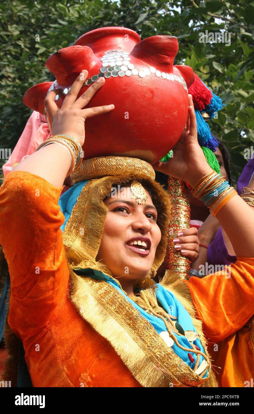 Students perform "Gidda", a traditional dance of Punjab at a procession ...