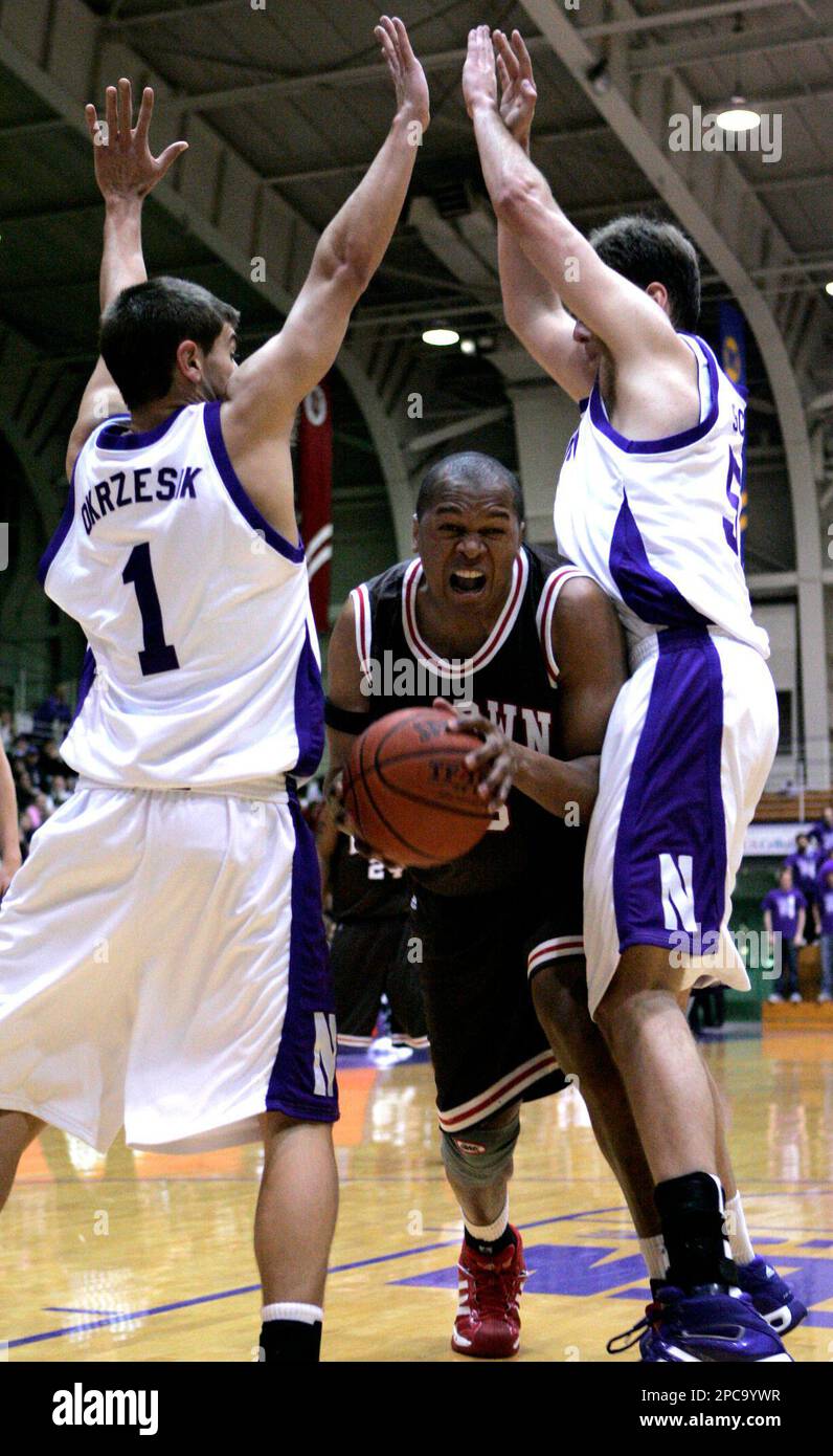 Brown's Sam Manhanga, center, collides with Northwestern's Jason ...