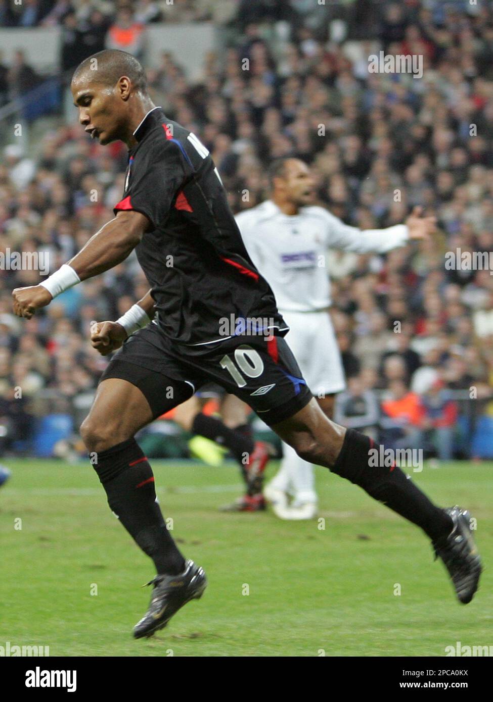 Lyon's Florent Malouda celebrates after scoring against Real Madrid in ...