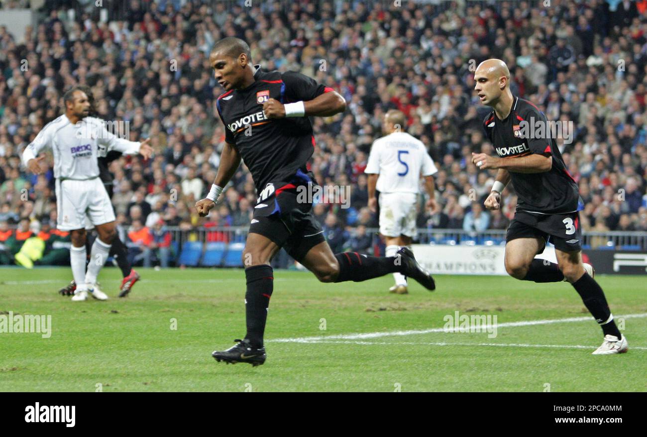 Lyon's Florent Malouda, centre, celebrates after scoring against Real ...